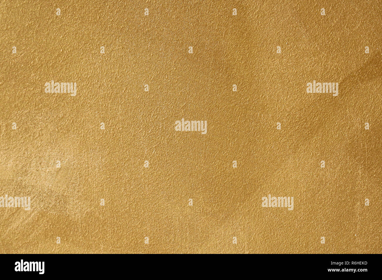 Shiny gold wall Stock Photo - Alamy