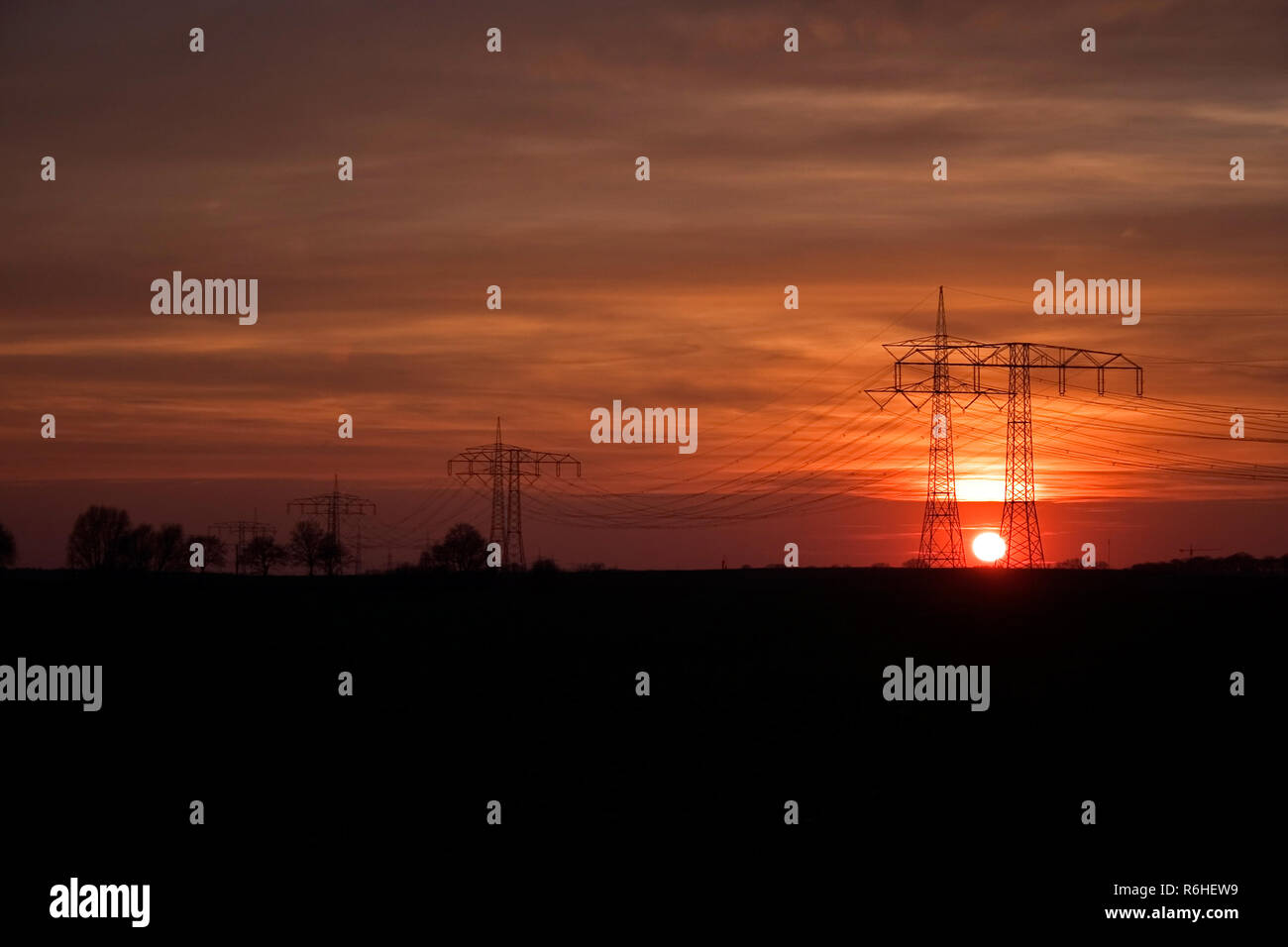 electricity pylon in the sunset Stock Photo - Alamy