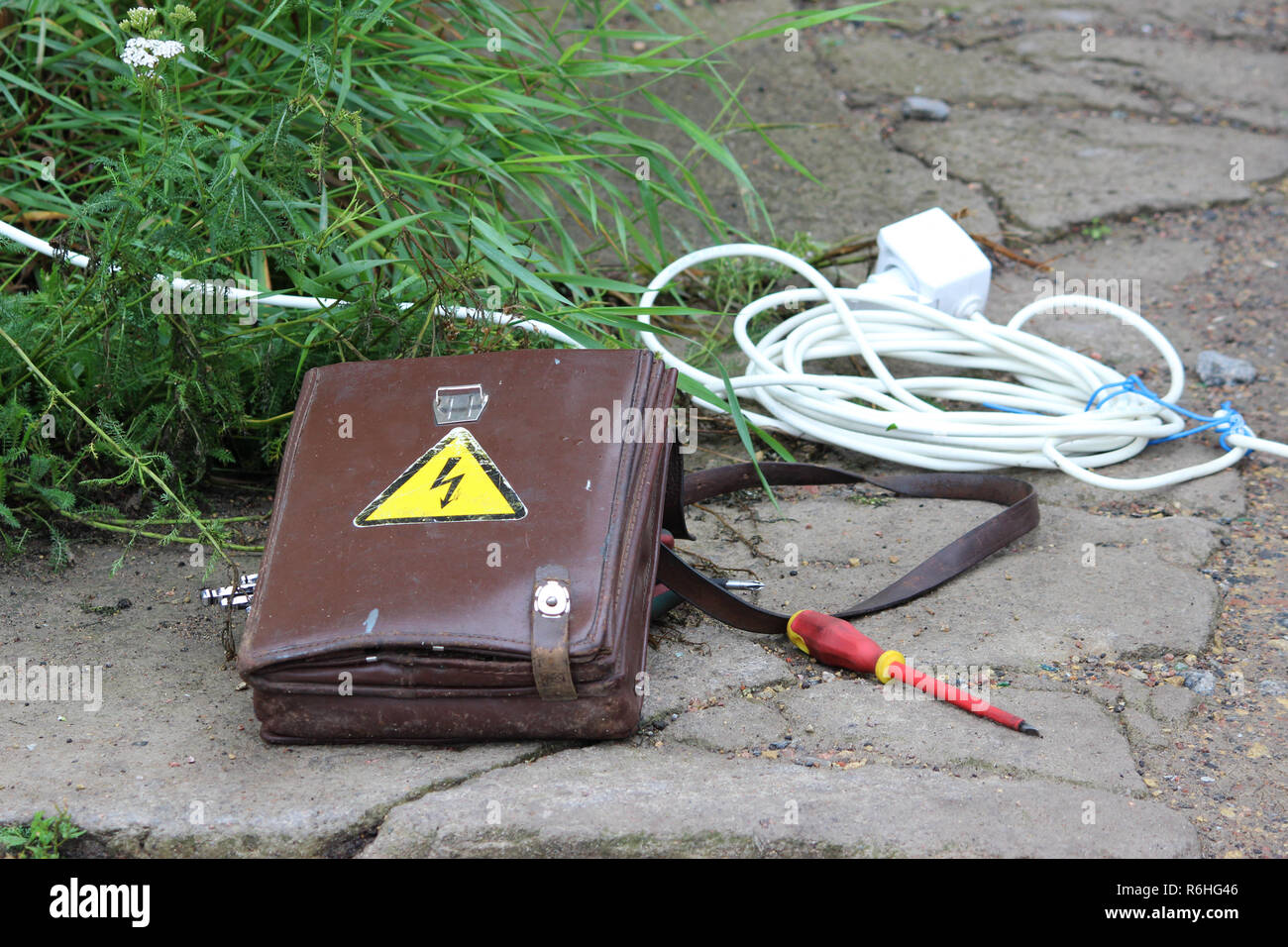 electrician things folder, extension and indicator screwdriver are on ...