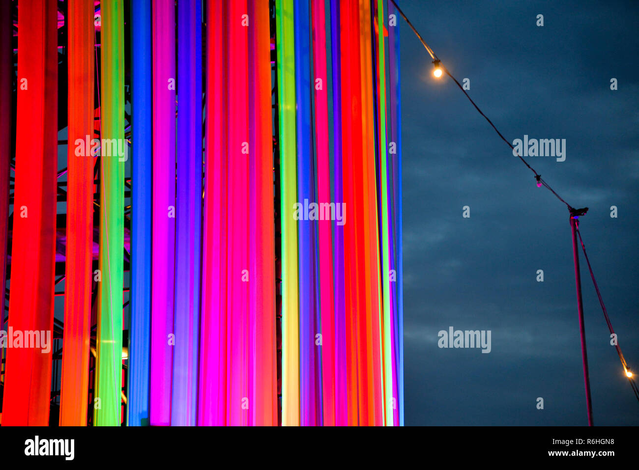 Colorful light installation in outdoor music and arts festival during ...