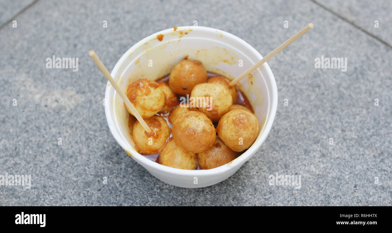 Eating fish ball together at outdoor, hong kong street food Stock Photo ...