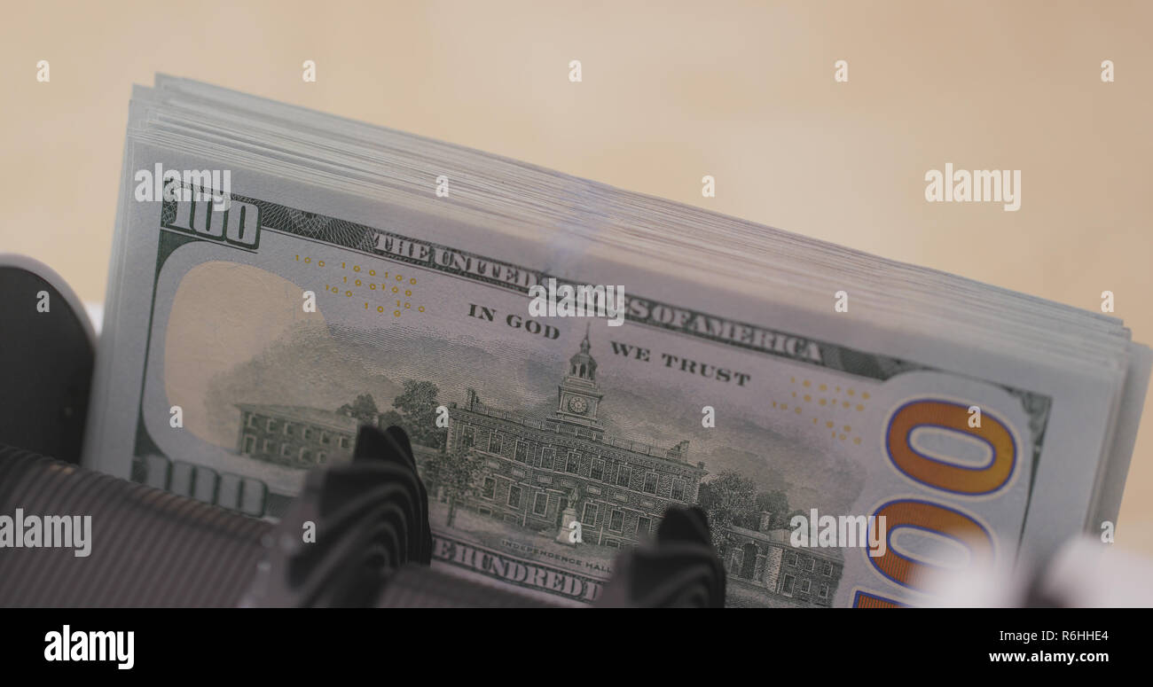 Cash money counting machine, checking number of US dollar Stock Photo ...