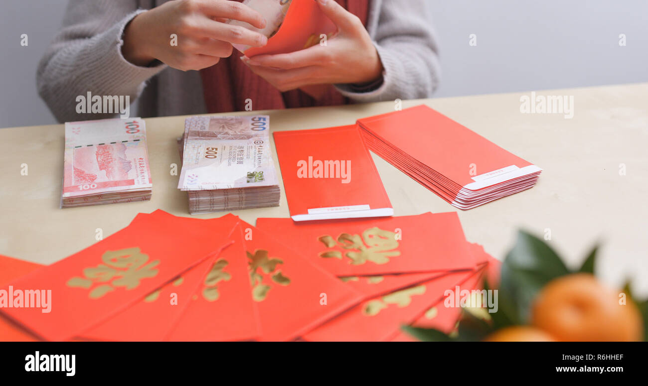 China lunar new year giving money hi-res stock photography and images ...
