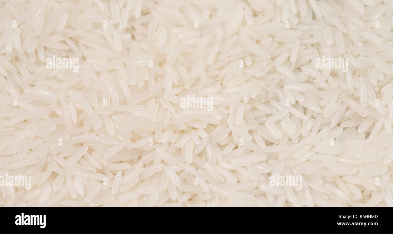 Pile of raw rice Stock Photo - Alamy