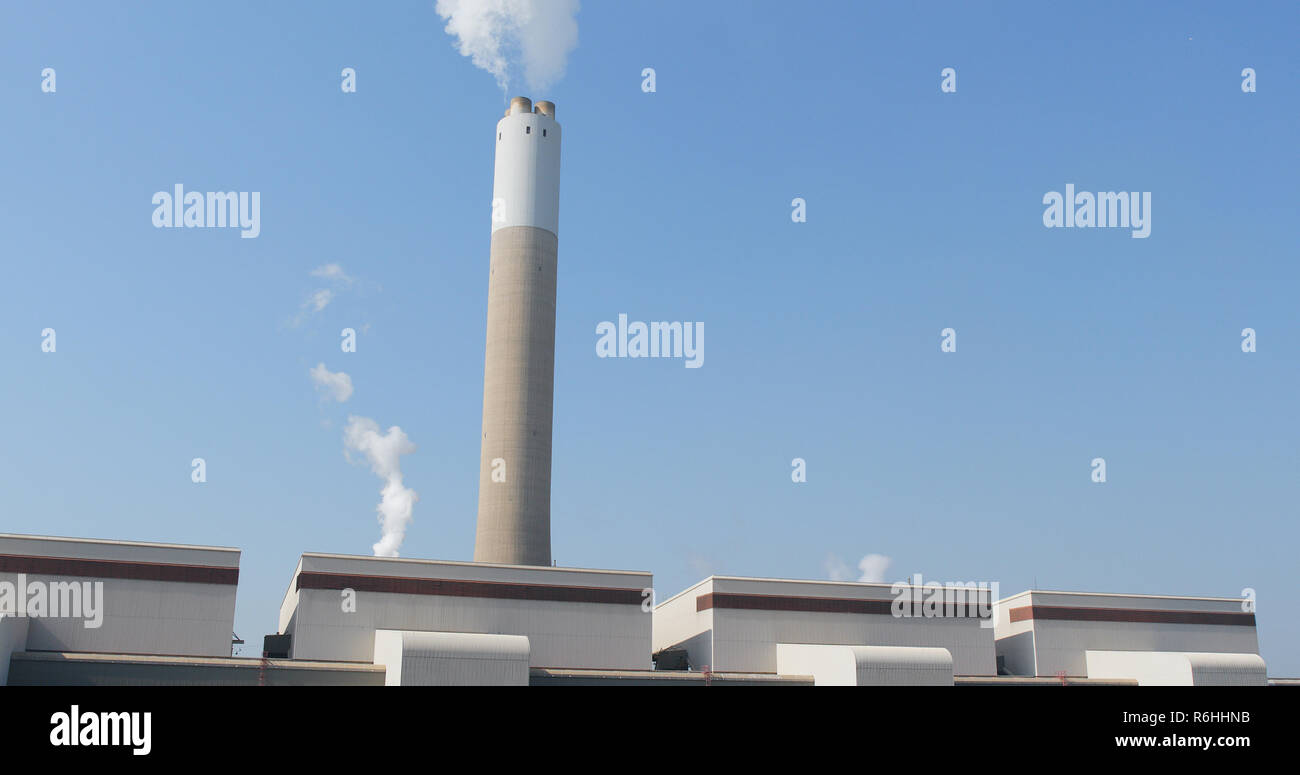 Industrial factory with clear blue sky Stock Photo - Alamy