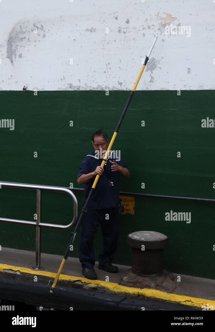 A seaman working for the Star Ferry at work in Hong Kong Harbour Stock ...