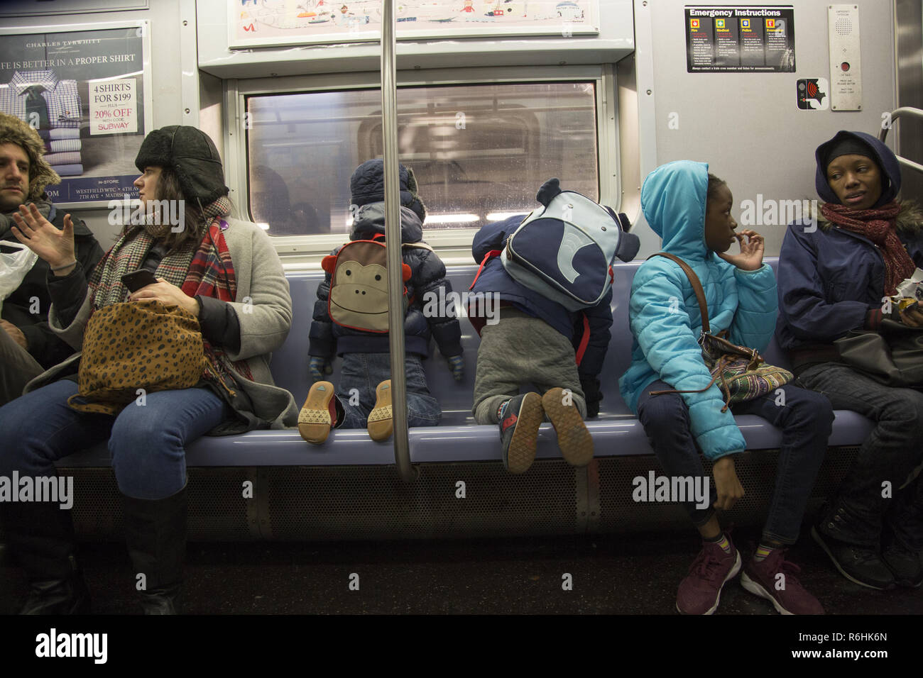 Kids with backpacks check out the Jay Street Metrotech subway station ...