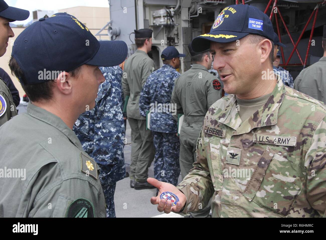 PACIFIC OCEAN (May 18, 2017)- Lt. Cmdr. Keith Johnson receives a coin ...