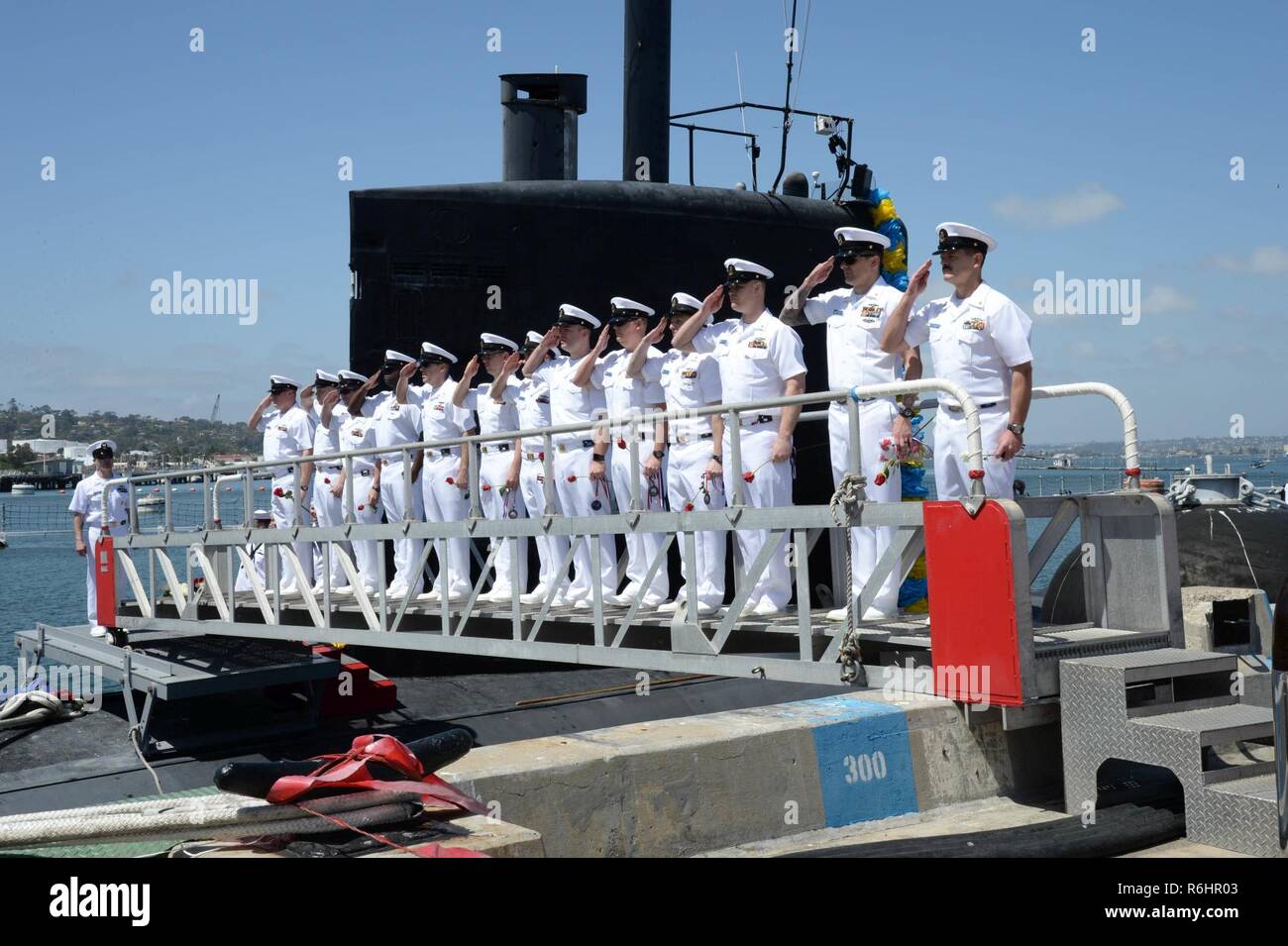 SAN DIEGO (May 18, 2017) Chief petty officers salute the ensign before ...