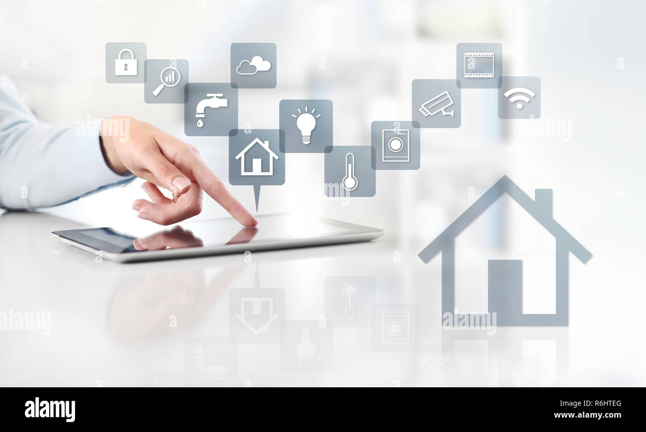 smart home automation control concept hand touch digital tablet screen ...