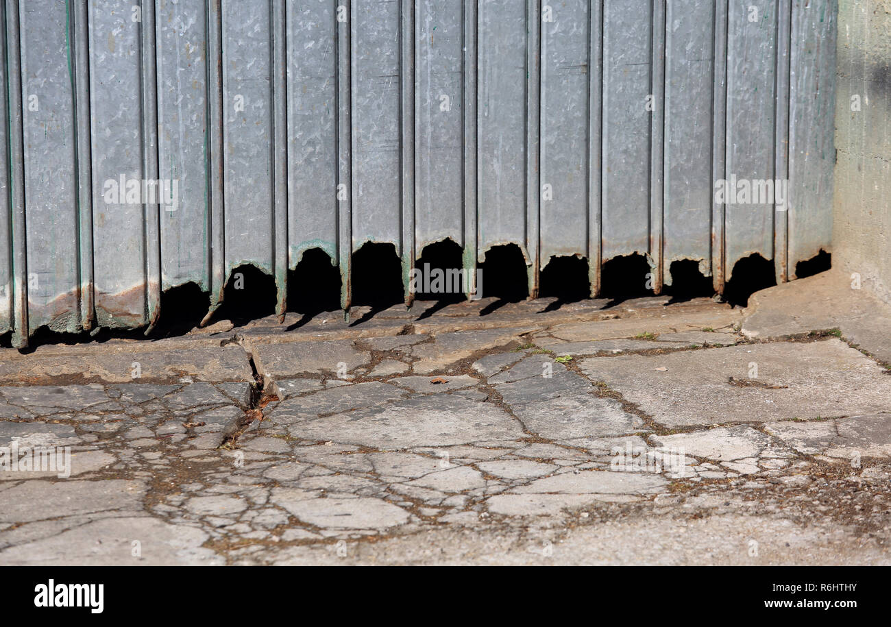 gate of the ruined garage broken by rain water and snow Stock Photo - Alamy