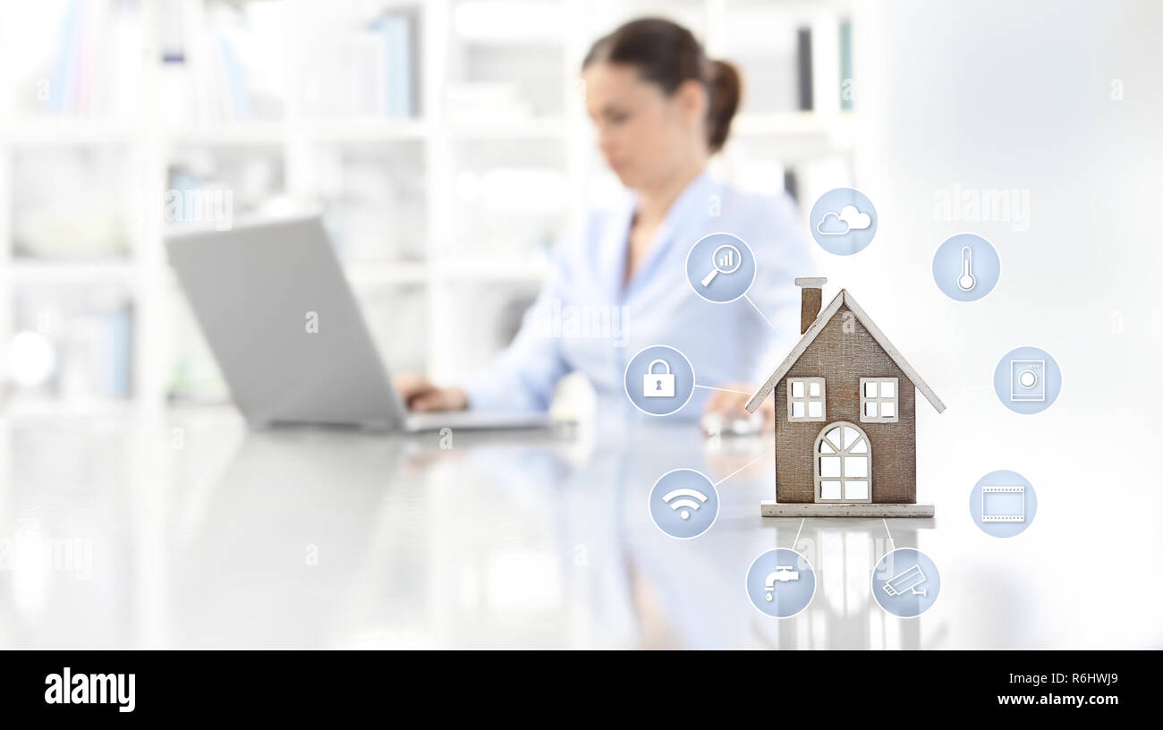 smart home automation concept house and symbols on idesktop with woman ...