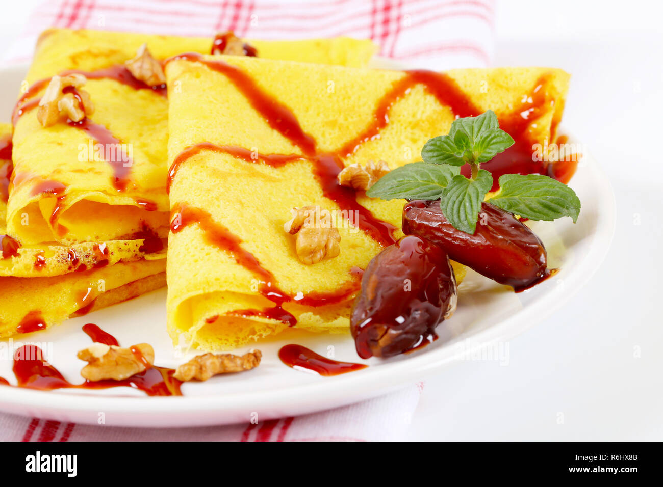 pancakes with walnuts, dates and date syrup Stock Photo - Alamy