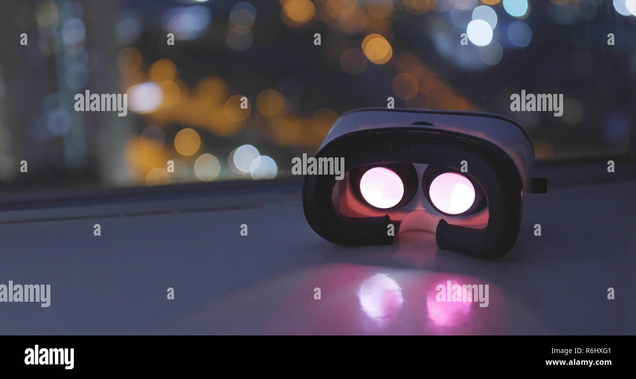 VR headset playing movie at night Stock Photo - Alamy