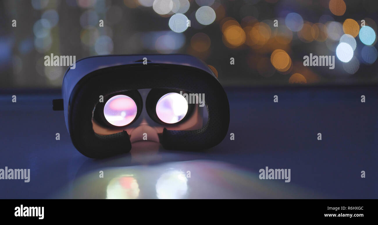 VR device playing inside at night Stock Photo - Alamy
