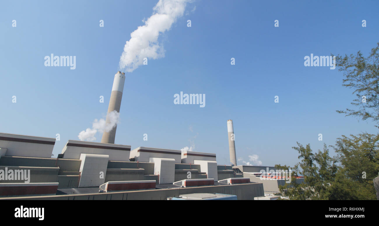 Factory over blue sky Stock Photo - Alamy