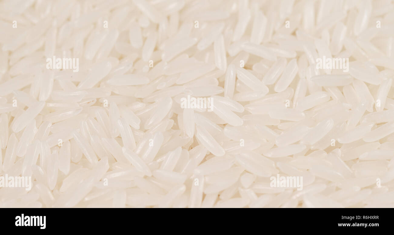 Pile of raw rice Stock Photo - Alamy