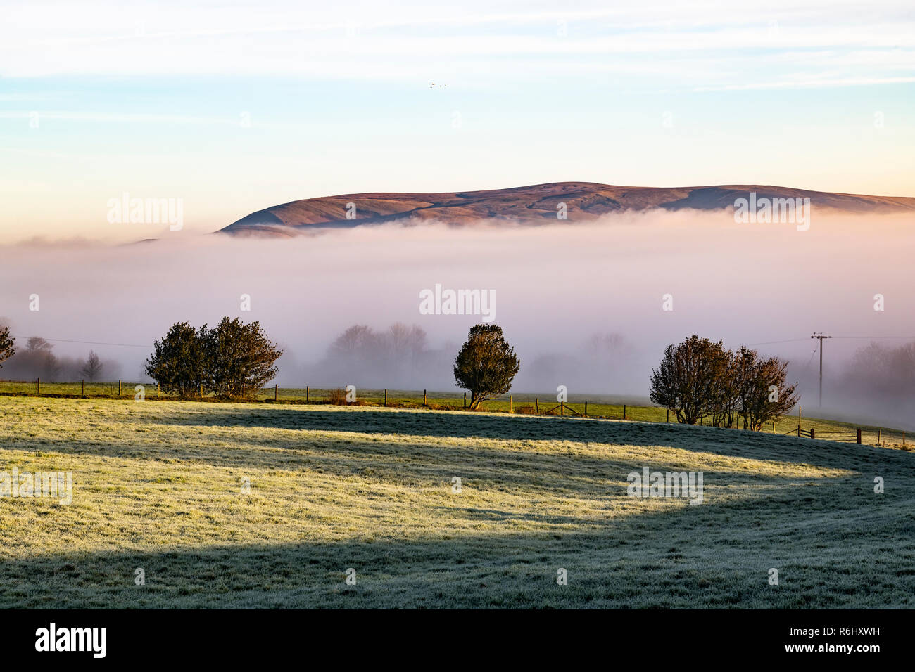 Pendle Hill on a misty day. Lancashire UK. Pendle Hill is famous for ...