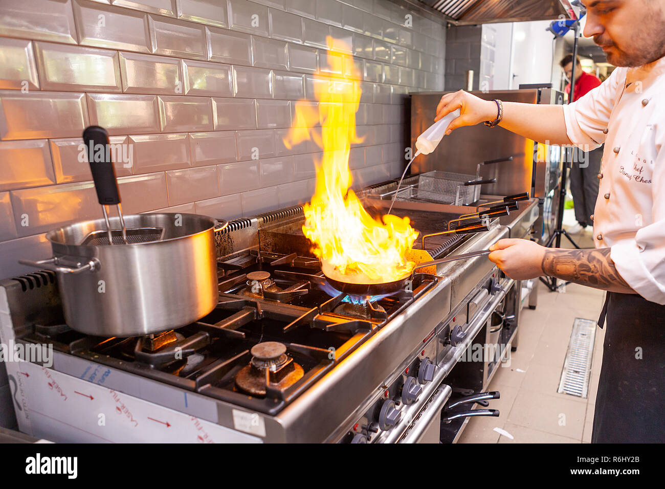 Flambe beef cooking in restarunat kitchen Stock Photo - Alamy