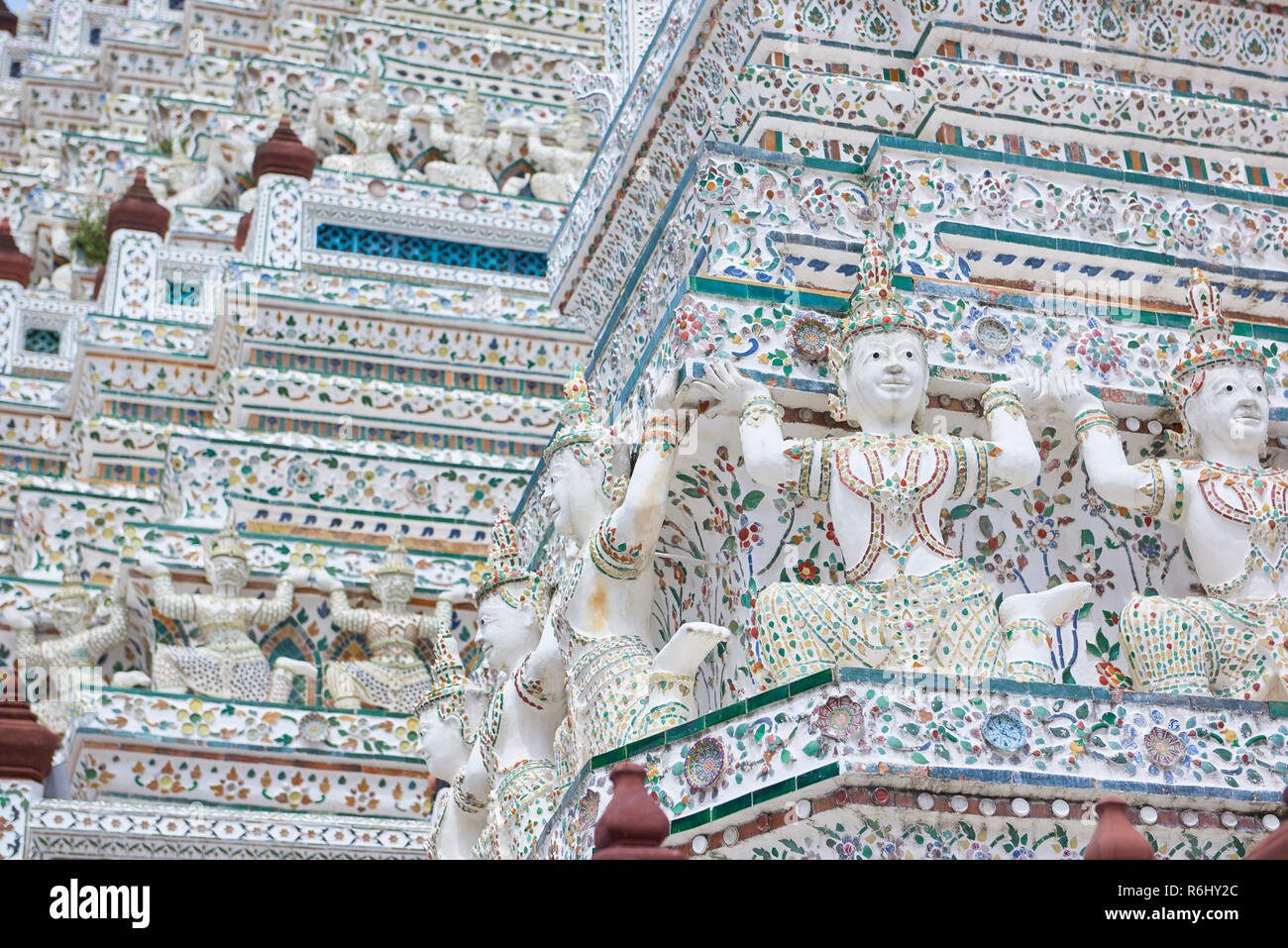 White Yaksha and dancer statues in Wat Arun temple in Bangkok, Thailand ...
