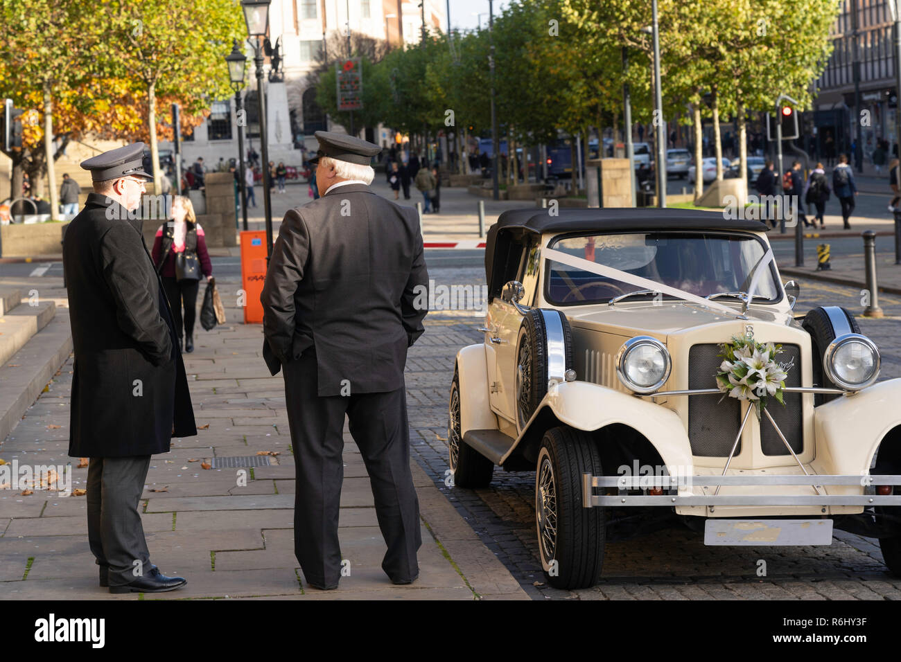 Two Chaffeur's waiting by a white Rolls-Royce car, Leeds, West ...