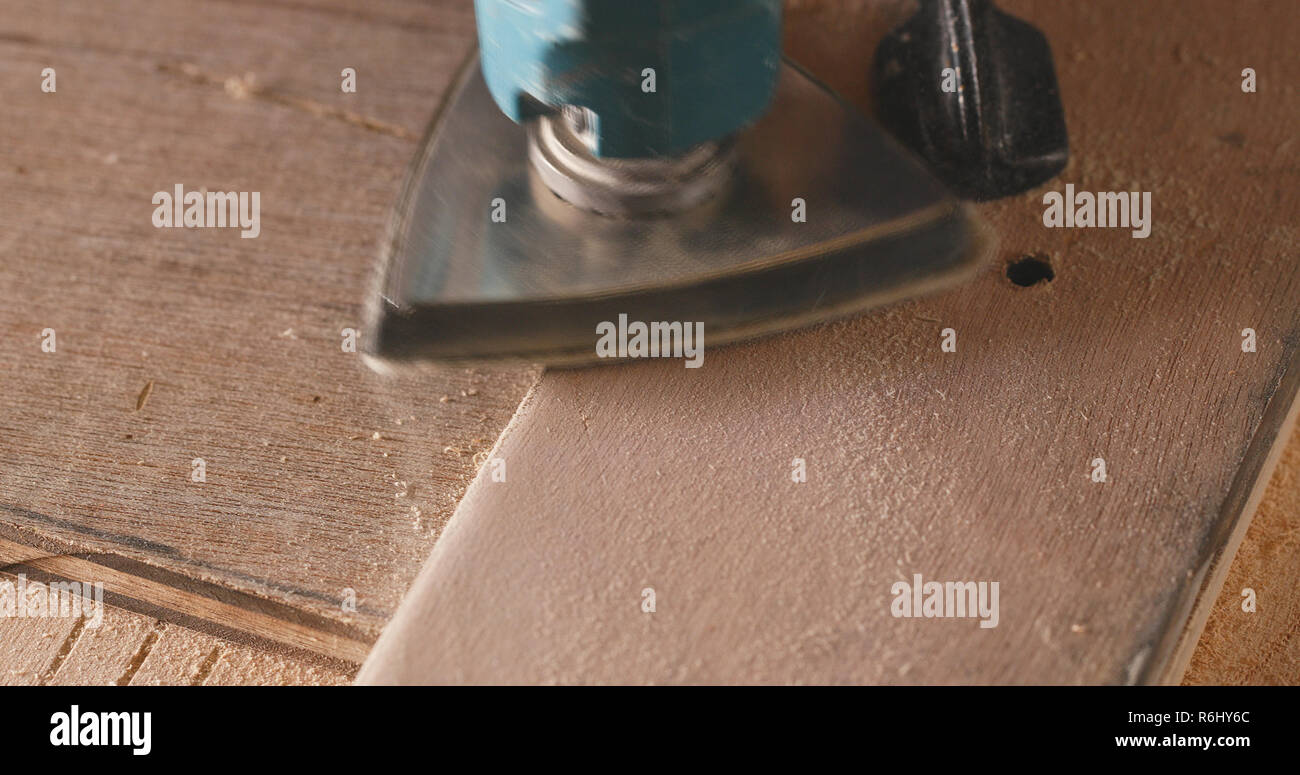 Wood grinder by electric hand router Stock Photo - Alamy