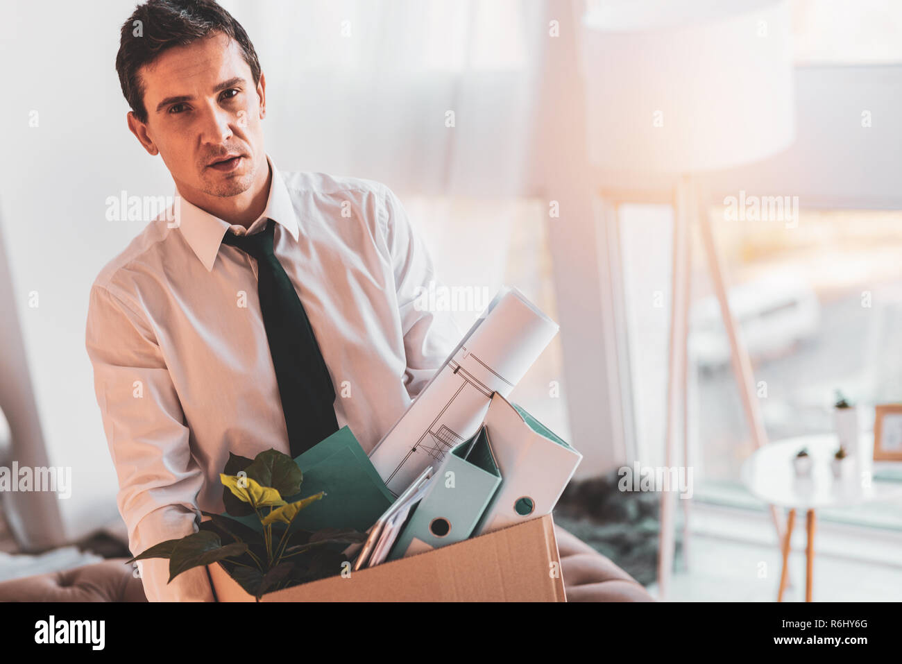 Handsome young man feeling terrible after losing his job Stock Photo ...