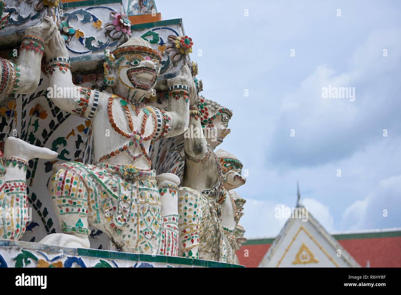 White Yaksha and dancer statues in Wat Arun temple in Bangkok, Thailand ...