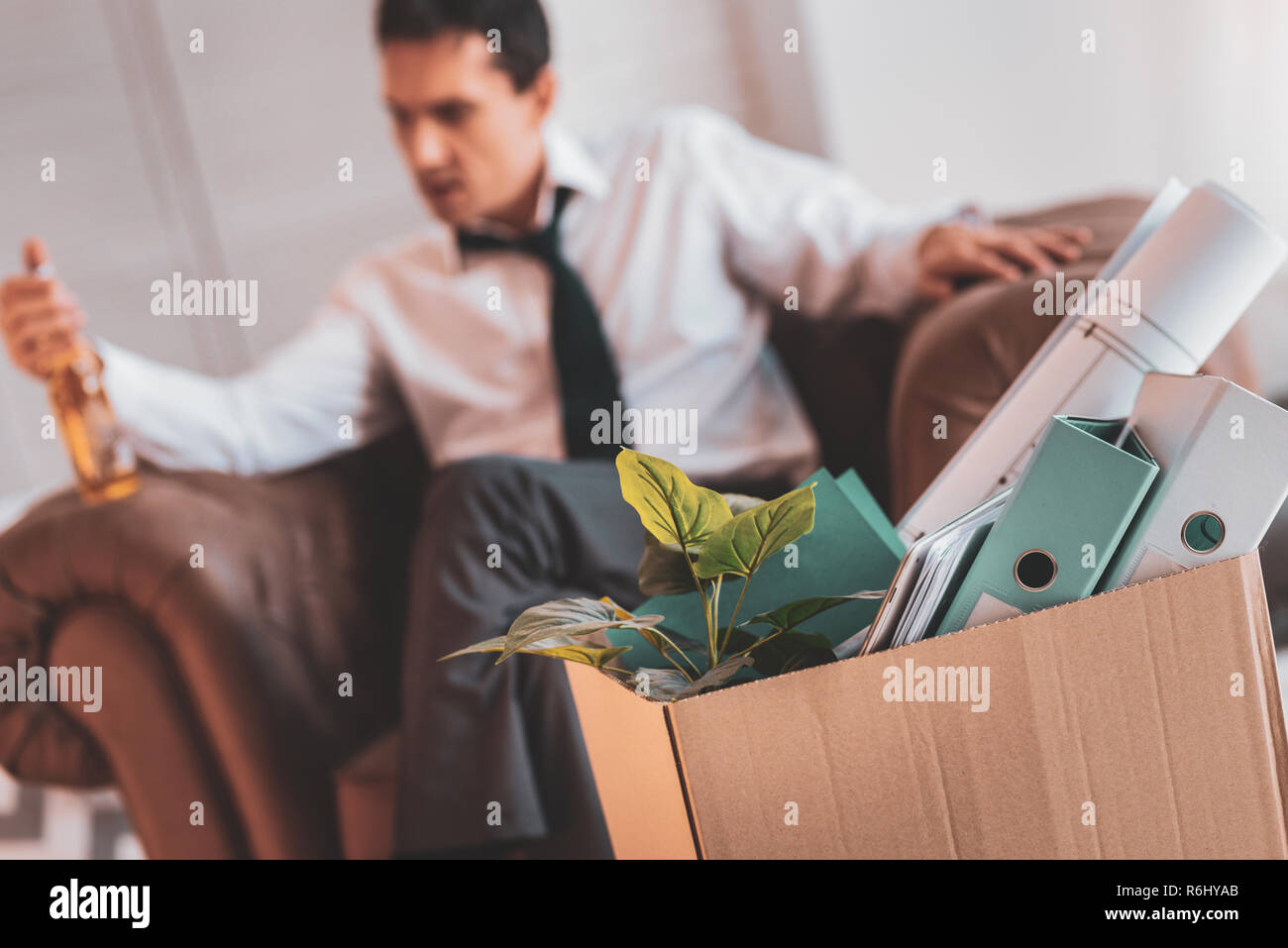 Unemployed man drinking alcohol while staying at home Stock Photo - Alamy