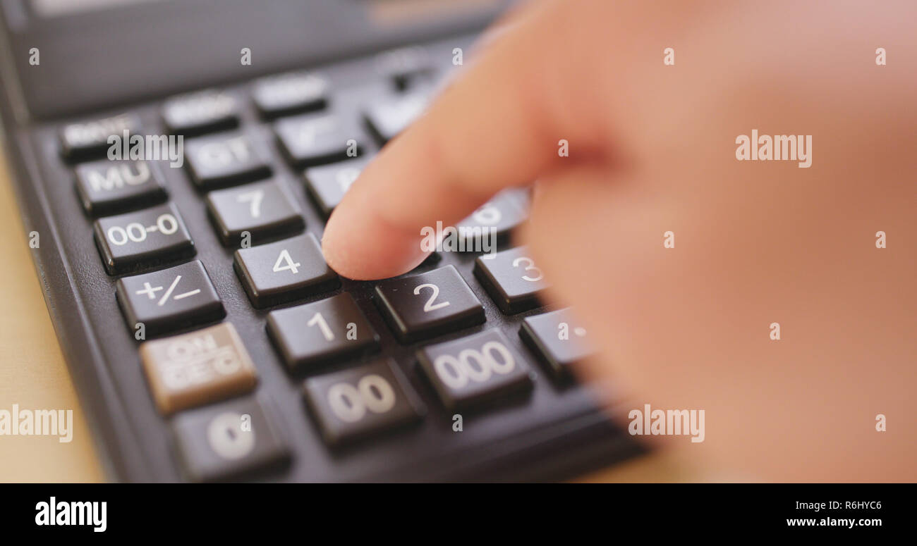 Use the calculator Stock Photo - Alamy