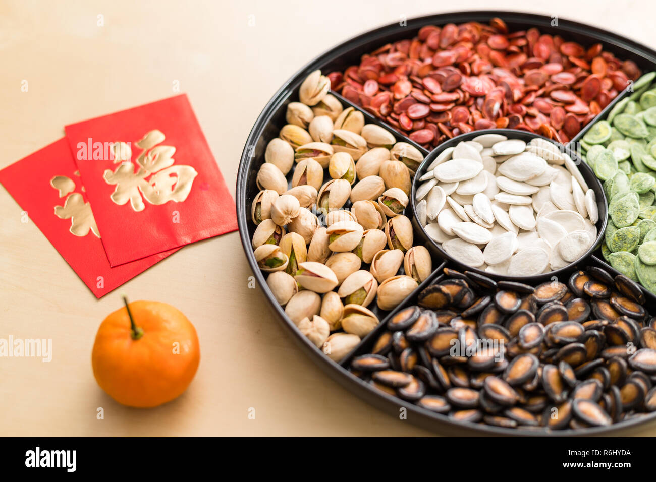 Traditional Chinese snack tray with red packet word mean luck Stock ...