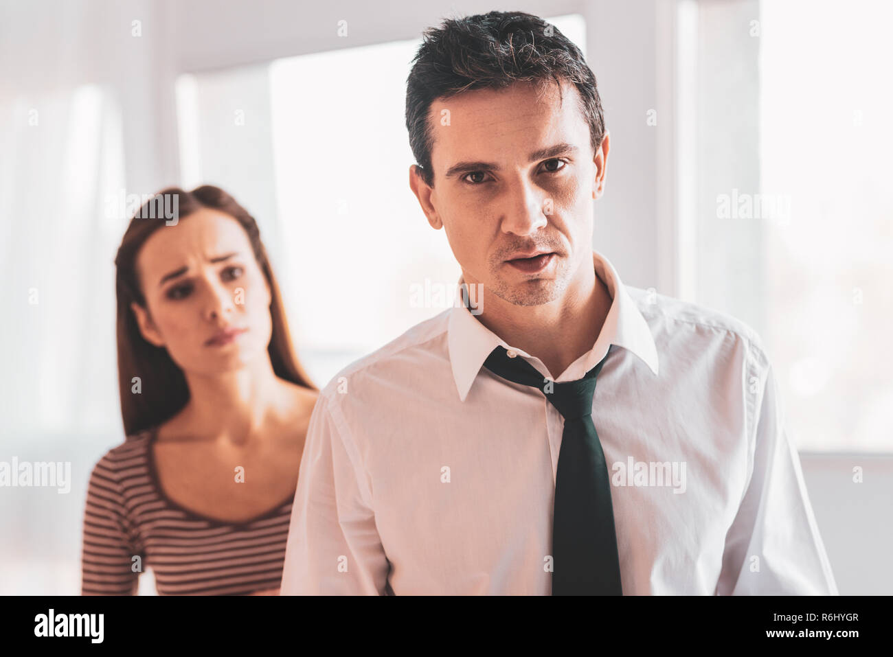 Angry man visiting a psychologist after losing his job Stock Photo - Alamy
