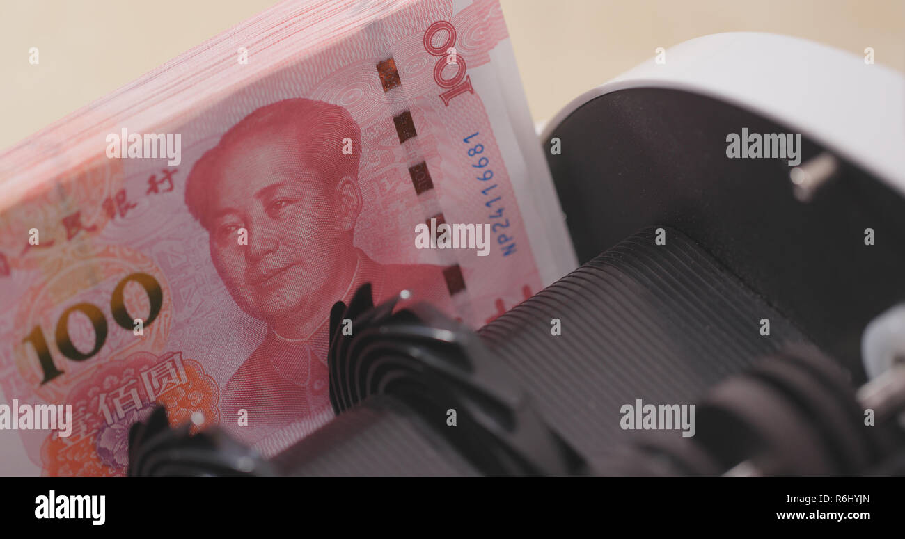 Money counting machine checking number of Chinese paper banknote Stock ...