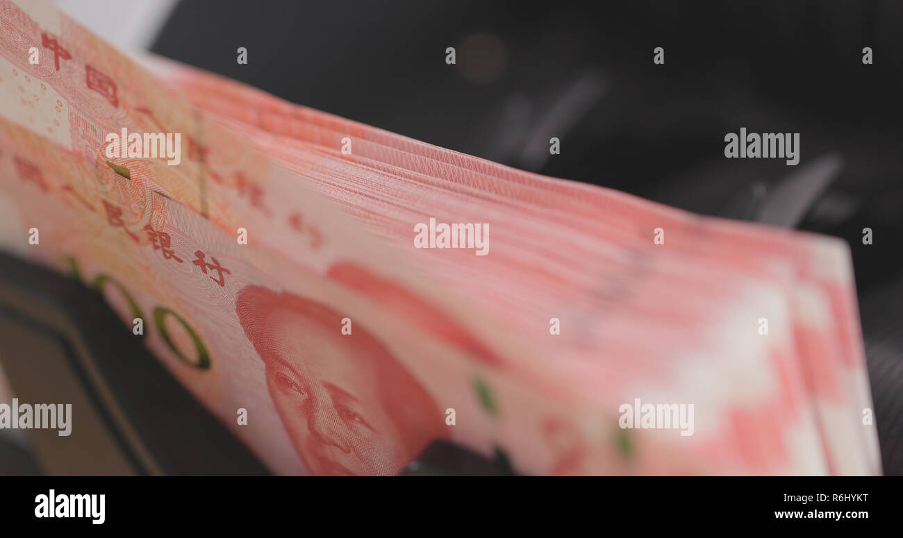 Hundred RMB banknotes in the counting machine Stock Photo - Alamy