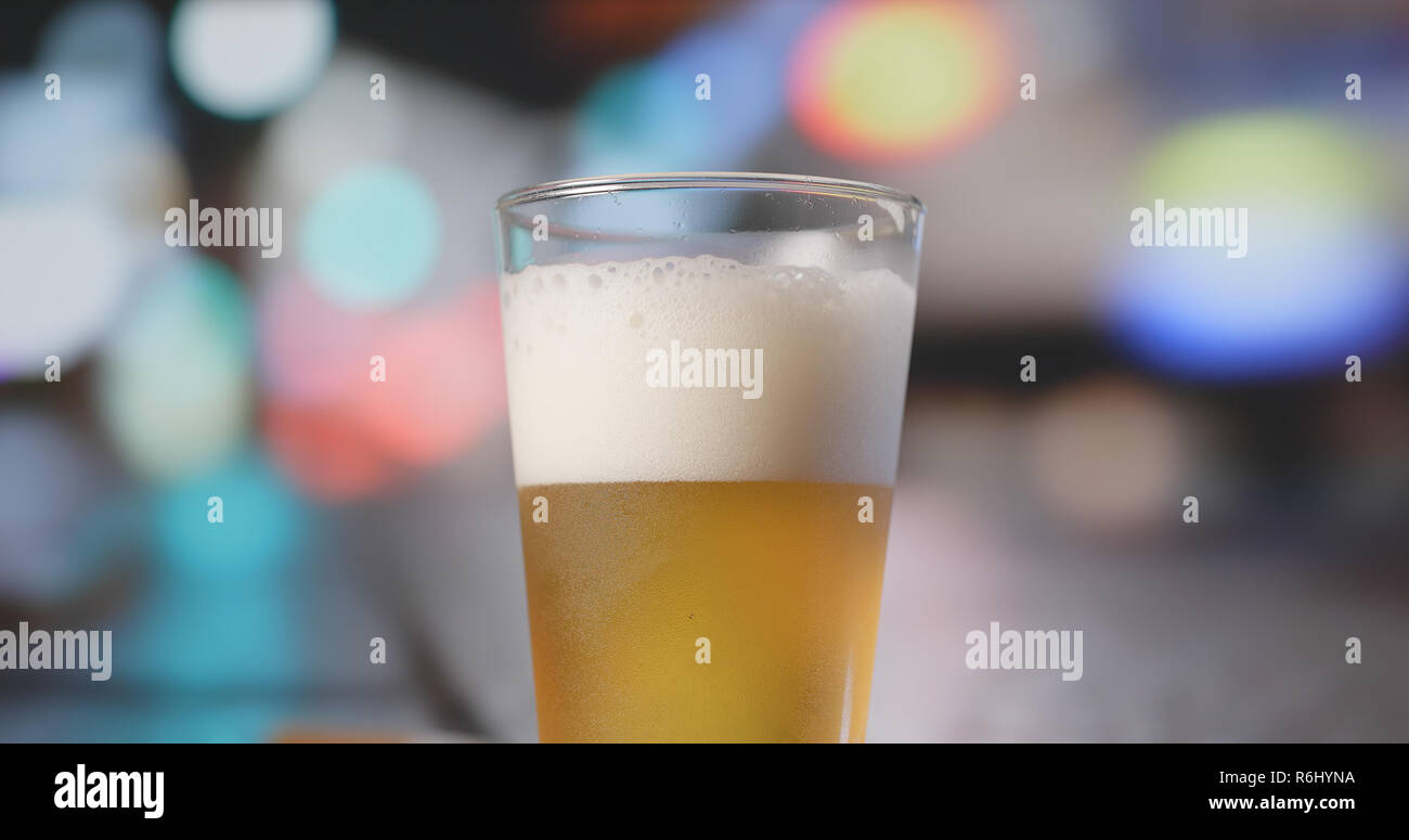 Beer with driving car at the background Stock Photo - Alamy