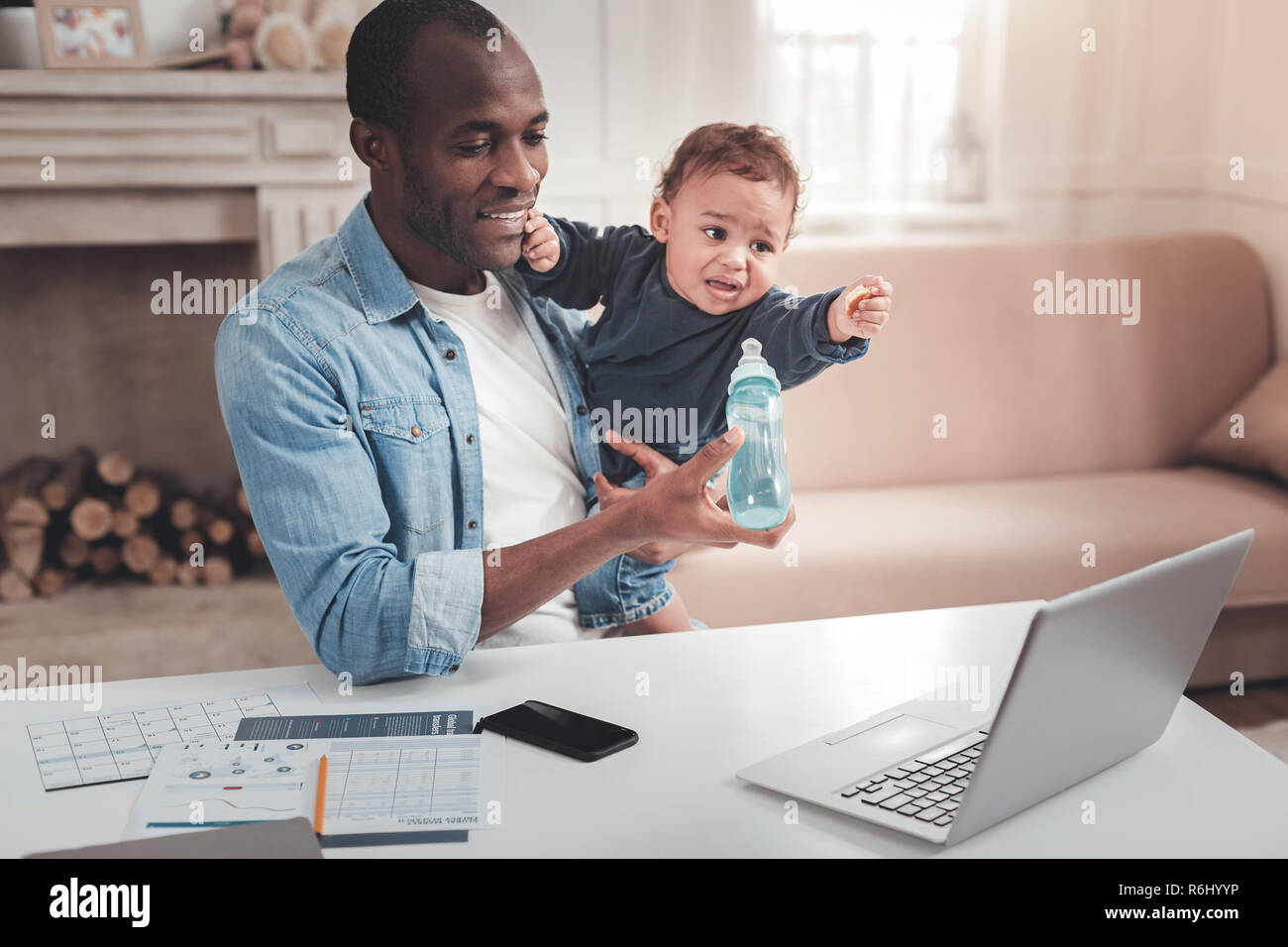 Cute small baby being hungry Stock Photo - Alamy