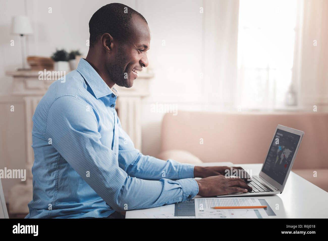 Smart cheerful man working Stock Photo - Alamy