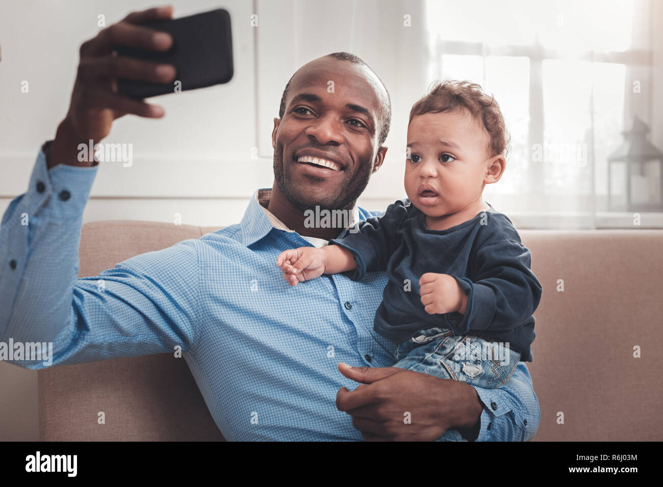 Positive nice man smiling Stock Photo - Alamy