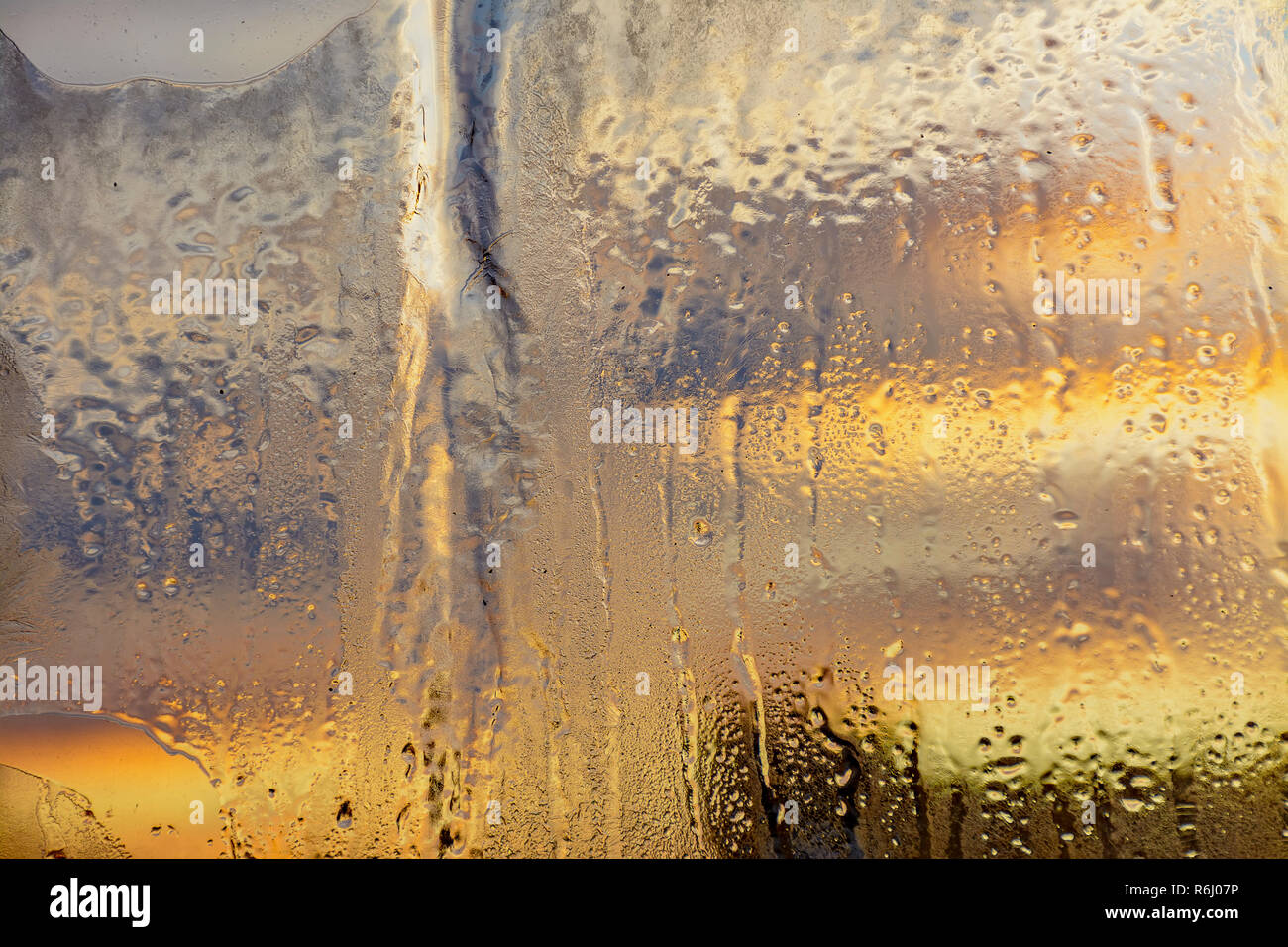 Cold November dawn through a frozen window Stock Photo - Alamy