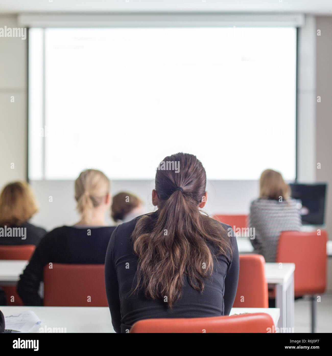 Audience in the lecture hall listening to academic presentation Stock ...