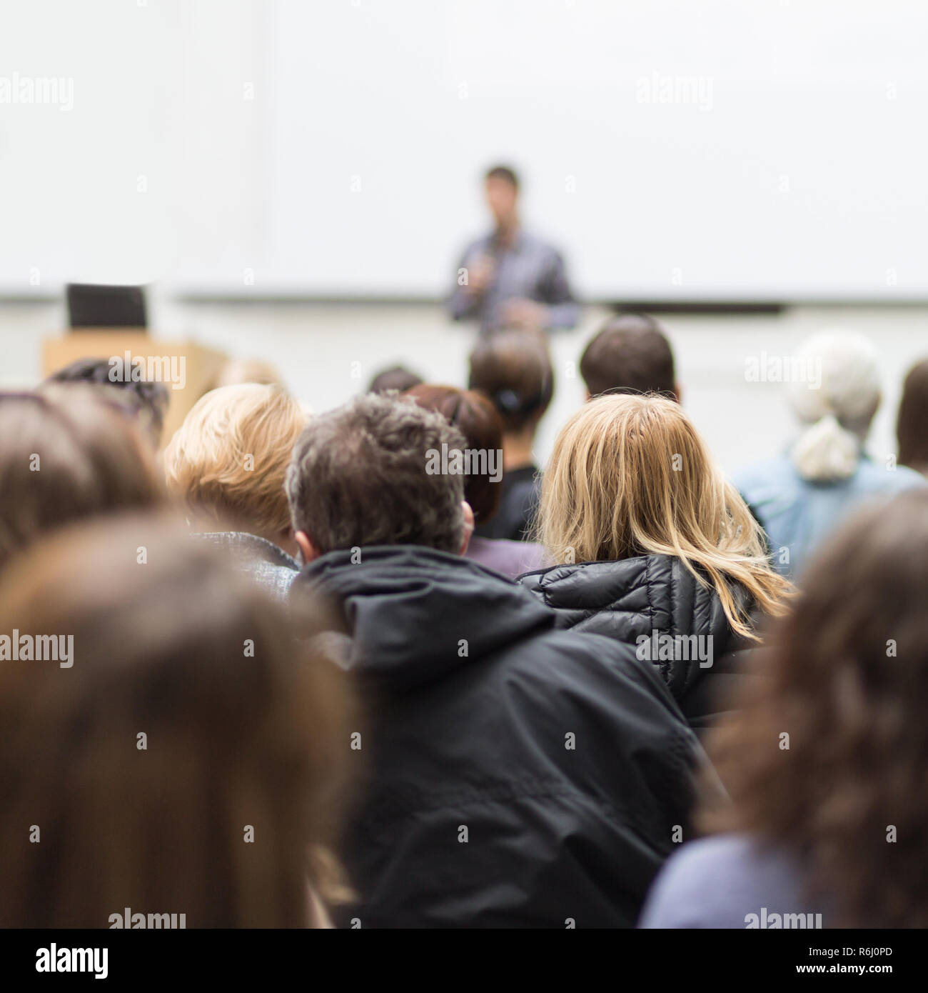 Man giving presentation in lecture hall at university Stock Photo - Alamy