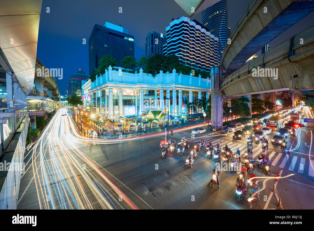Creative high angle night shot of Ratchaprasong Intersection and Erawan ...