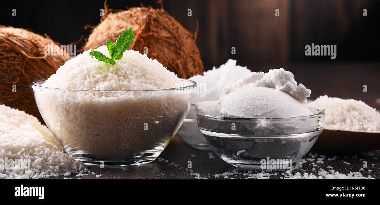 Composition with bowl of shredded coconut and shells Stock Photo - Alamy
