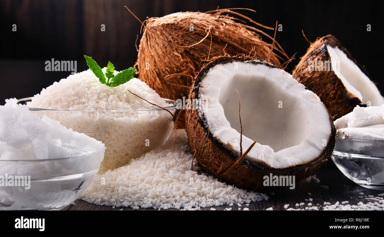 Composition with bowl of shredded coconut and shells Stock Photo - Alamy
