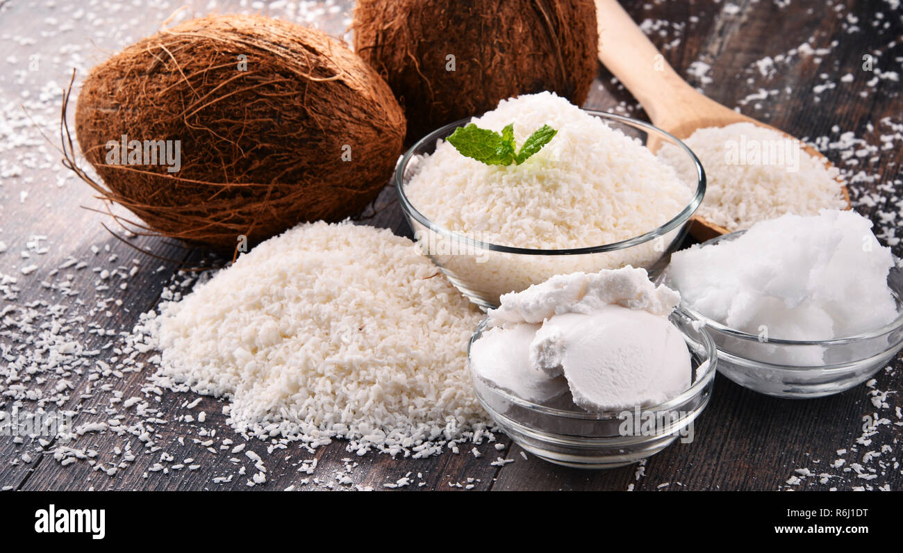 Composition with bowl of shredded coconut and shells Stock Photo - Alamy