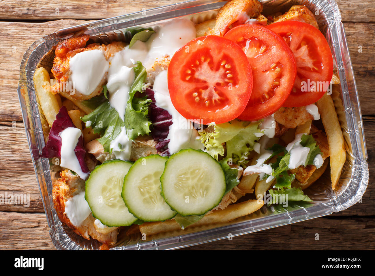 Recipe Dutch fast food kapsalon of french fries, chicken, fresh salad ...
