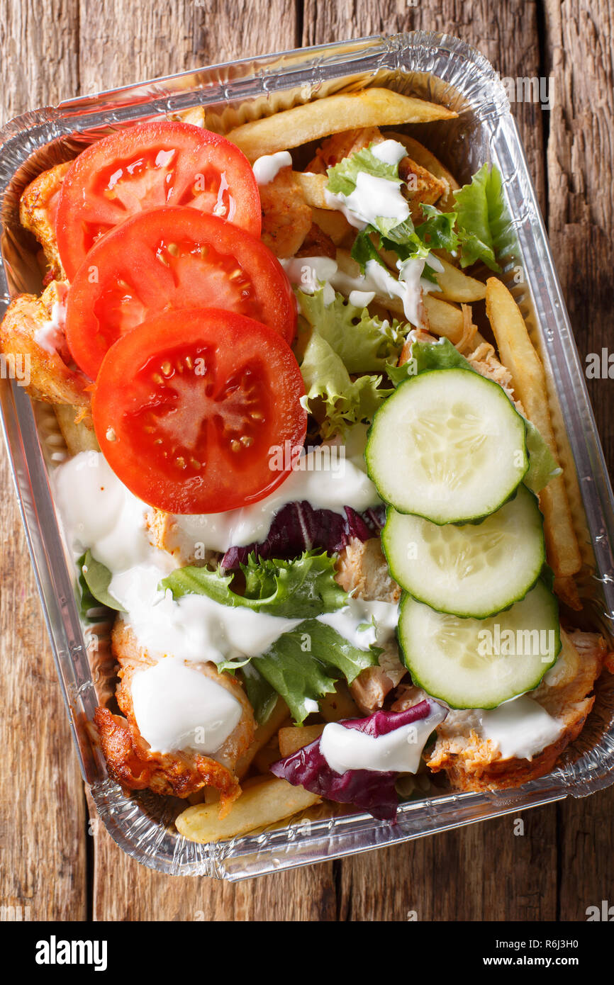 Recipe Dutch fast food kapsalon of french fries, chicken, fresh salad ...