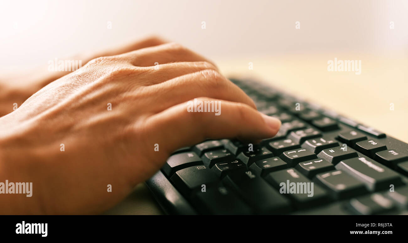 Typing on keyboard Stock Photo - Alamy