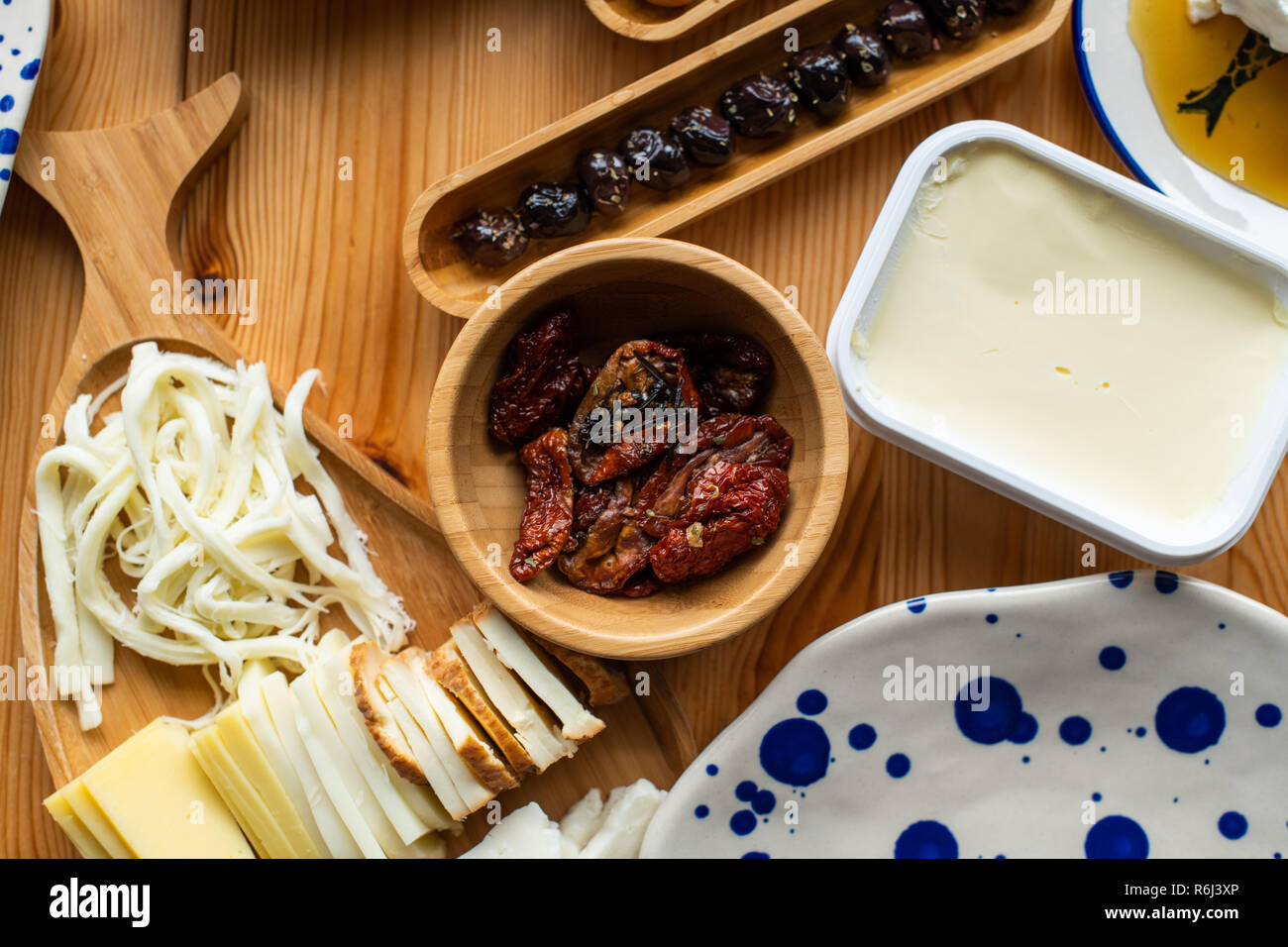 Traditional Turkish Breakfast, eggs with sucuk, bal kaymak, olives, ham ...