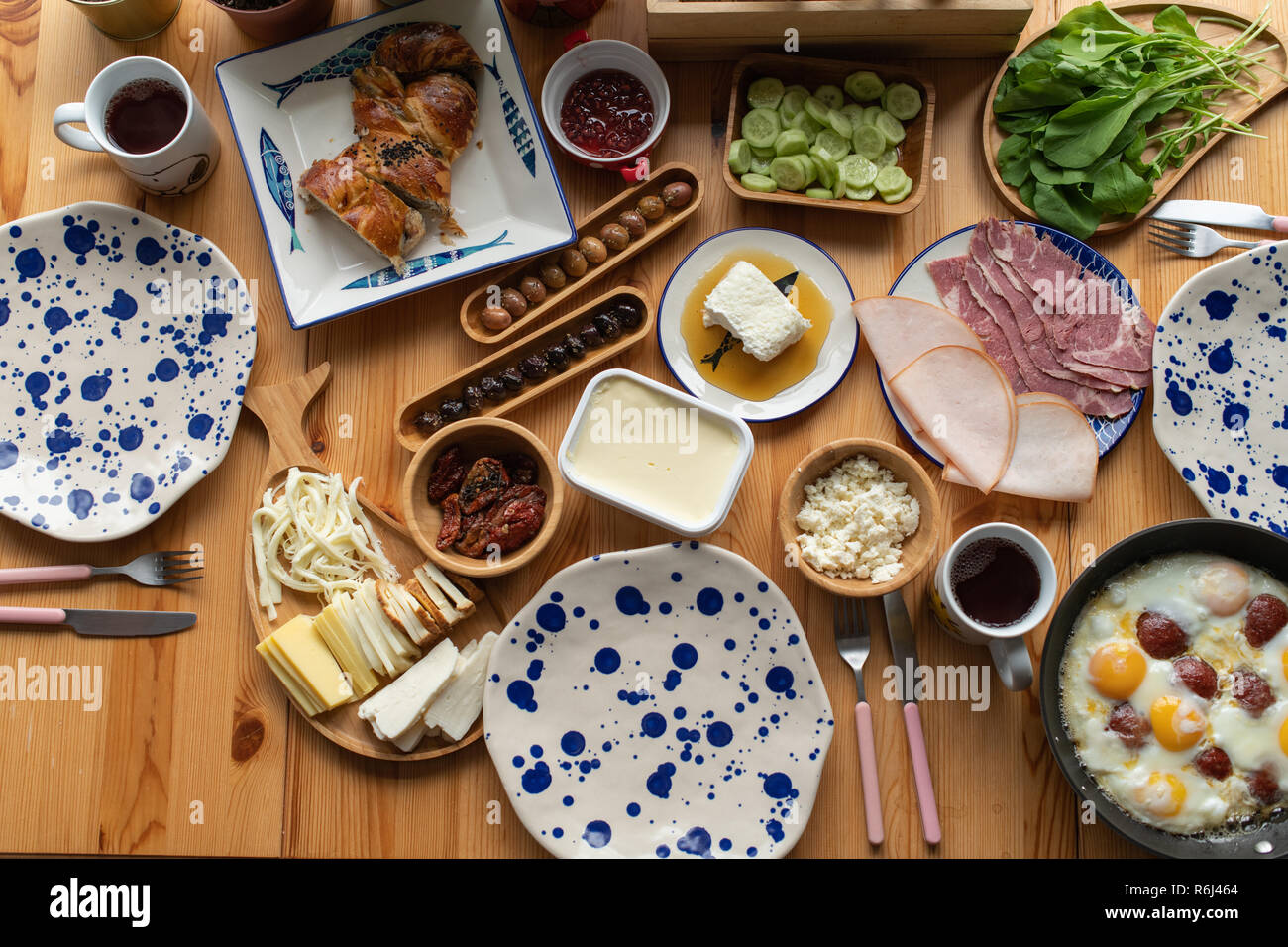 Traditional Turkish Breakfast, eggs with sucuk, bal kaymak, olives, ham ...